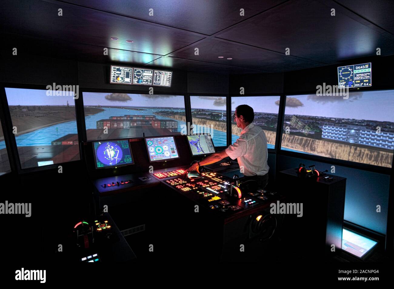Container ship bridge simulator. Crew member training in a simulator ...