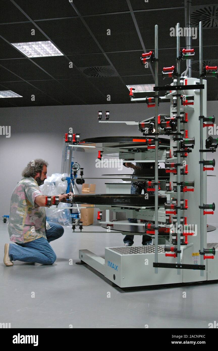 3D cinema. Projectionist changing 3D film reels in the projection booth ...
