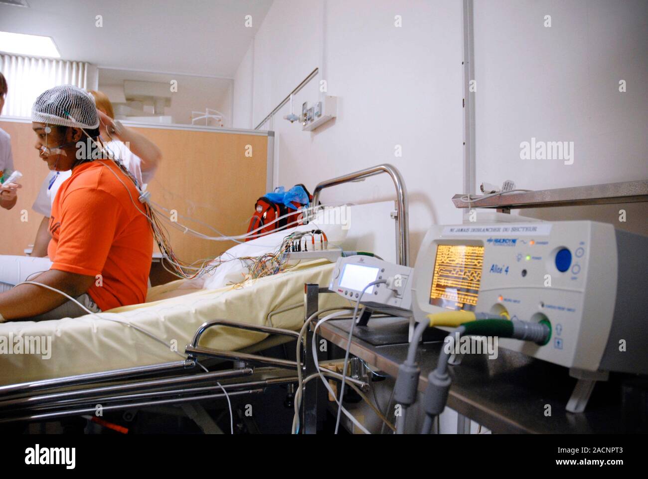 Paediatric sleep study. Teenage boy with narcolepsy being prepared for ...