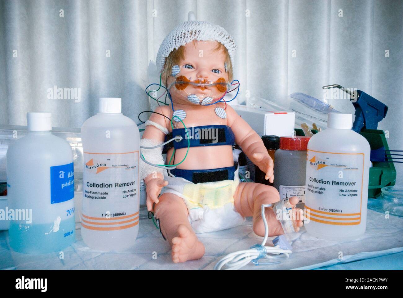 Paediatric sleep study. Doll used to explain the equipment that will be ...