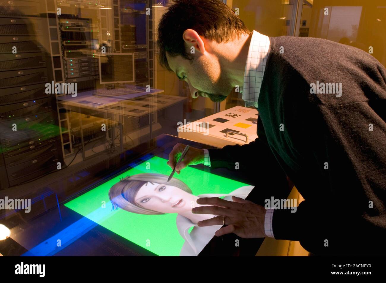 3D virtual avatar construction. Man using a computer program and ...