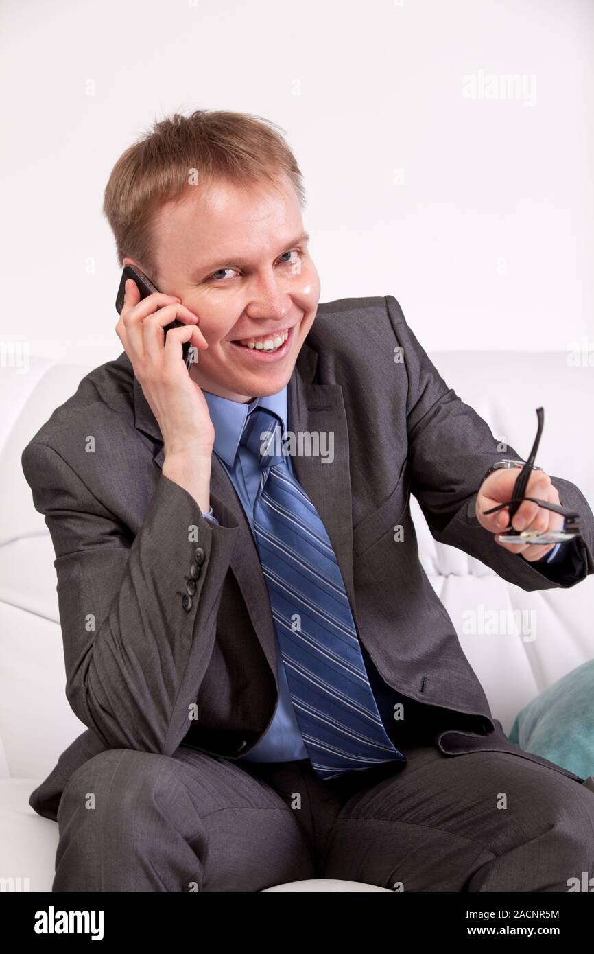 Attractive man sitting Stock Photo - Alamy