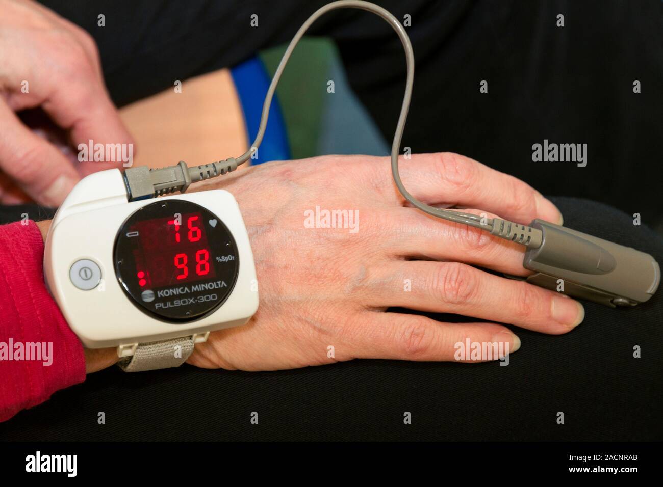 COPD research. Heart rate and blood oxygen levels being measured for a ...