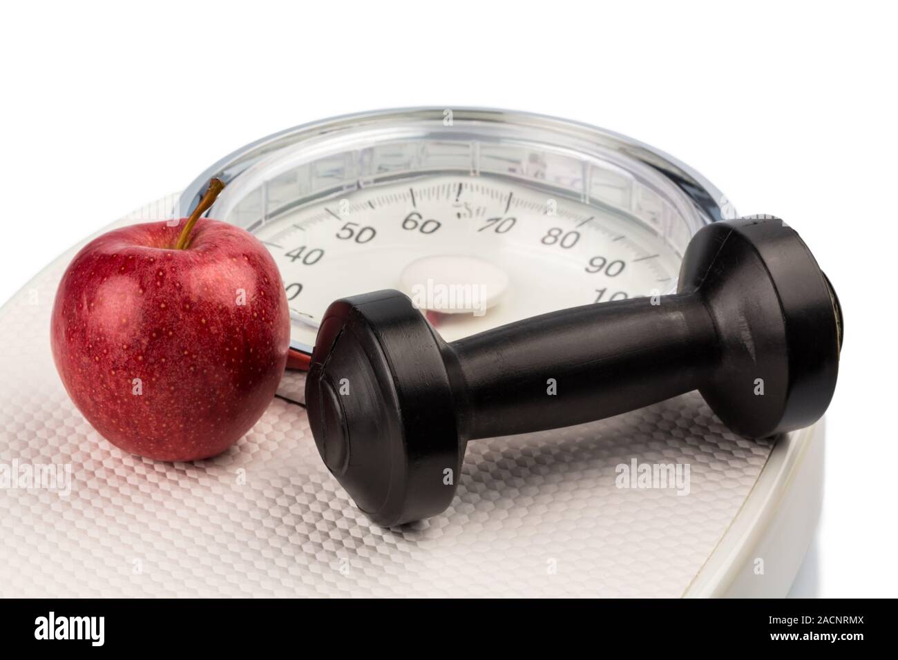 Apple lies on a scale Stock Photo - Alamy