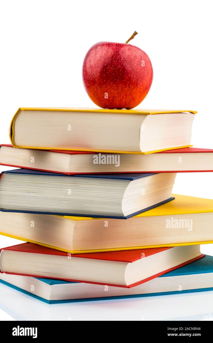Apple on a stack of books Stock Photo - Alamy