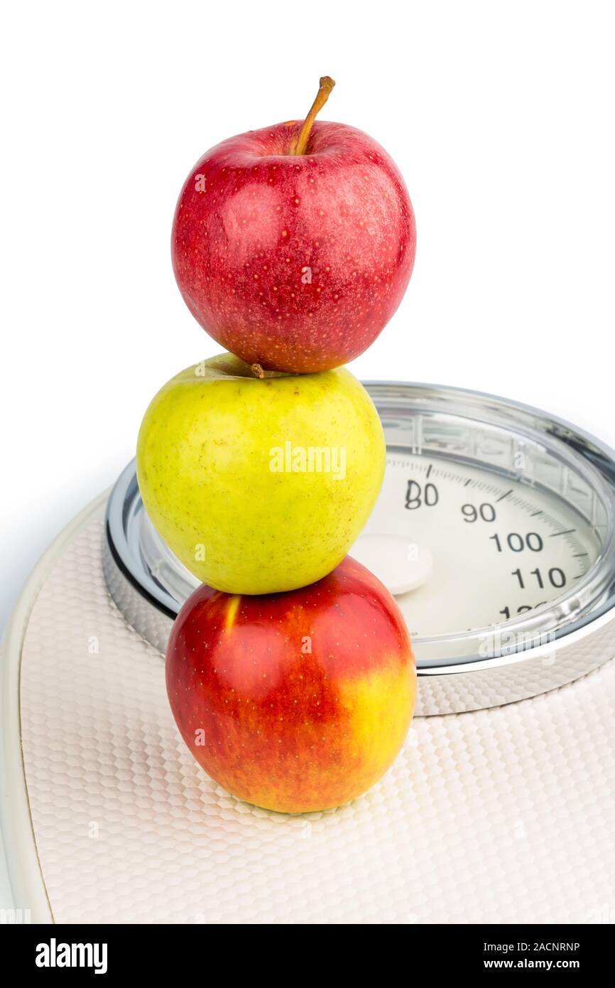 Apples on a scale Stock Photo - Alamy