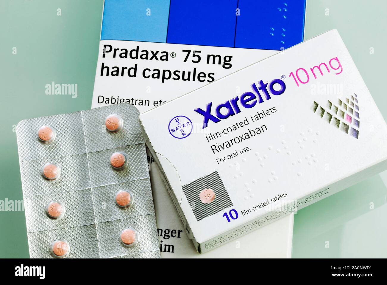 Anticoagulant drugs. Boxes of Pradaxa and Xarelto oral anticoagulant ...