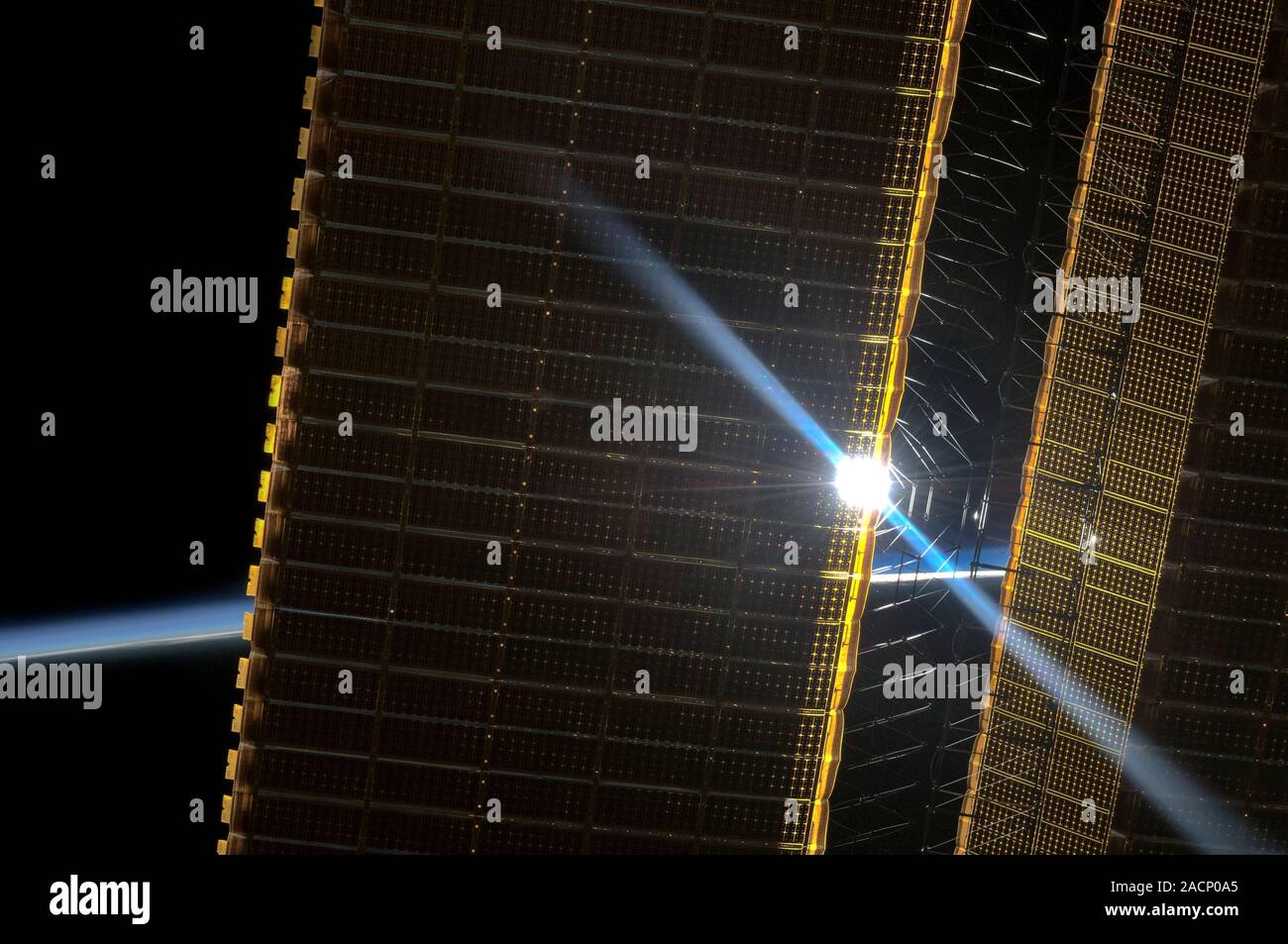 Solar array panel, ISS image. Photograph of the sun through the solar ...