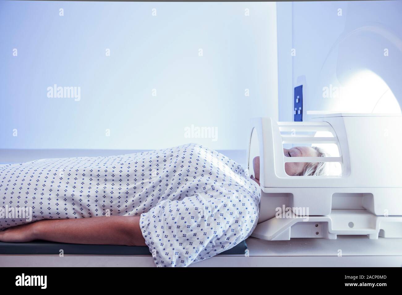 MRI scan. Female patient in an MRI (magnetic resonance imaging) scanner ...
