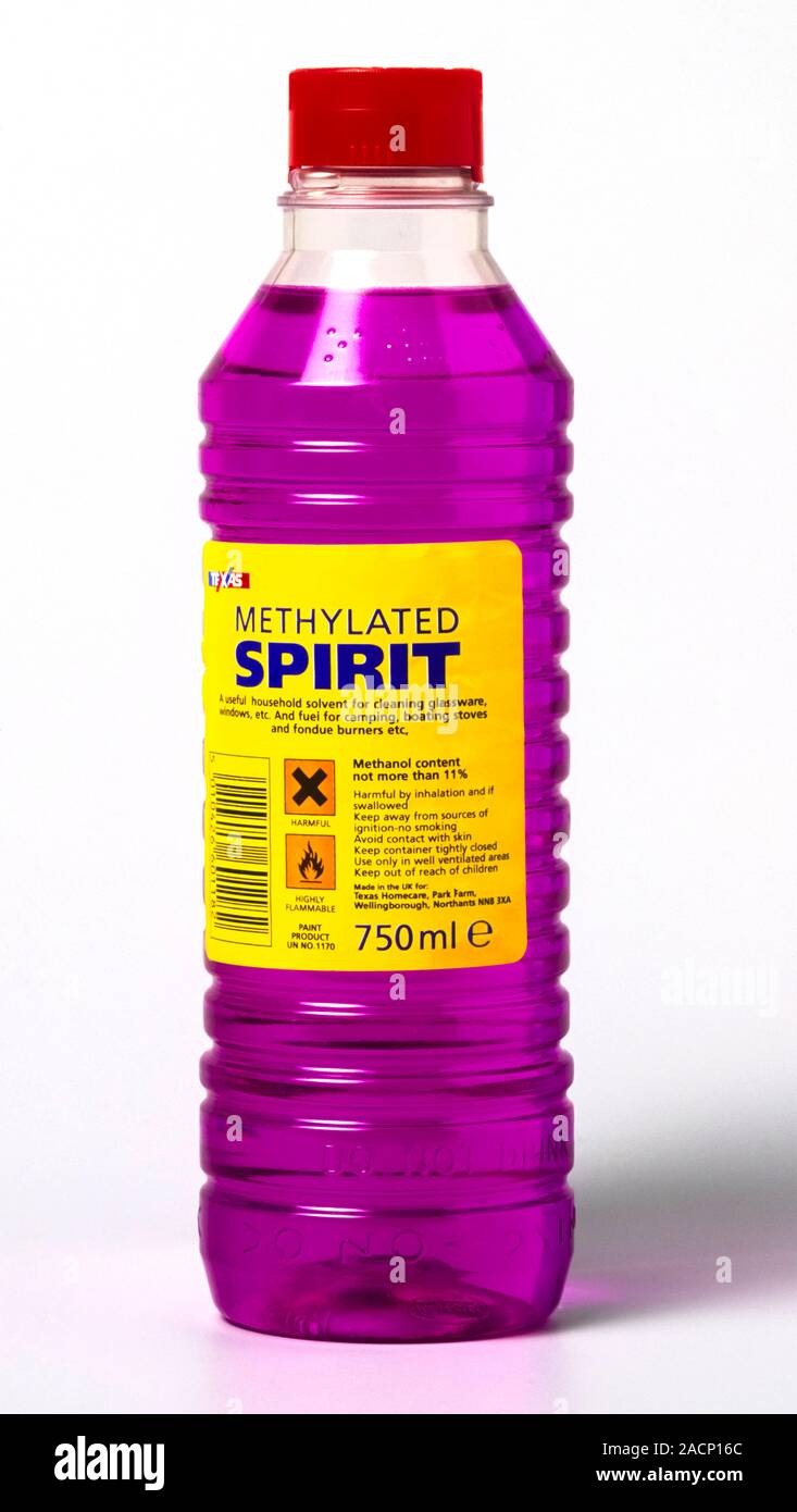 Methylated spirits. Labelled bottle of methylated spirits containing ...