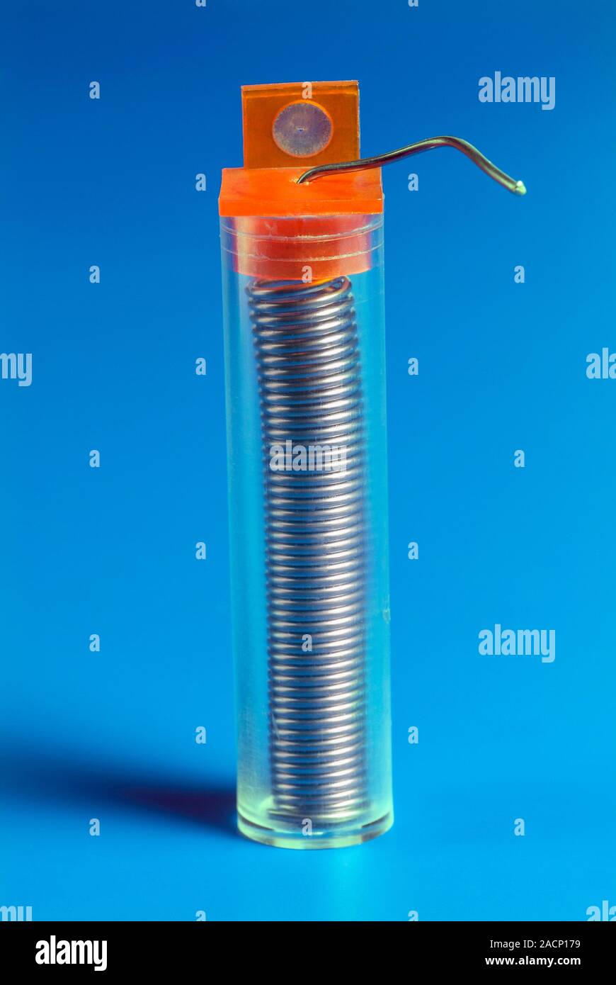 Solder coil and dispenser. Solder is an alloy that is melted to join ...
