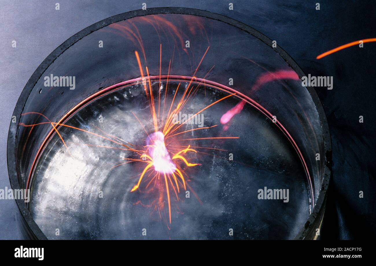 Potassium reacting with water in a water bath. Potassium is a highly ...