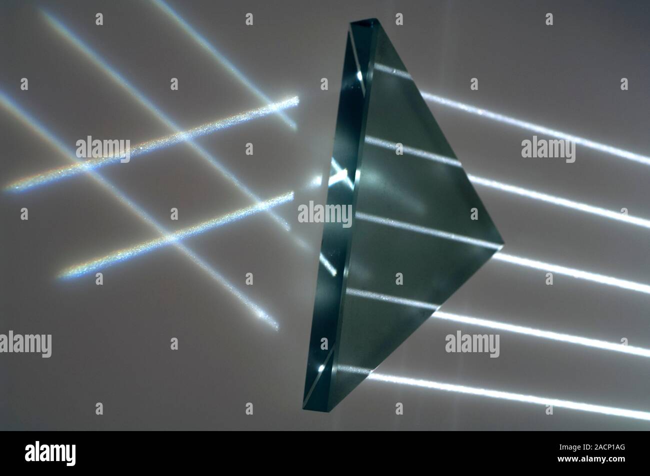 Light rays and triangular prism. As light rays pass between transparent ...