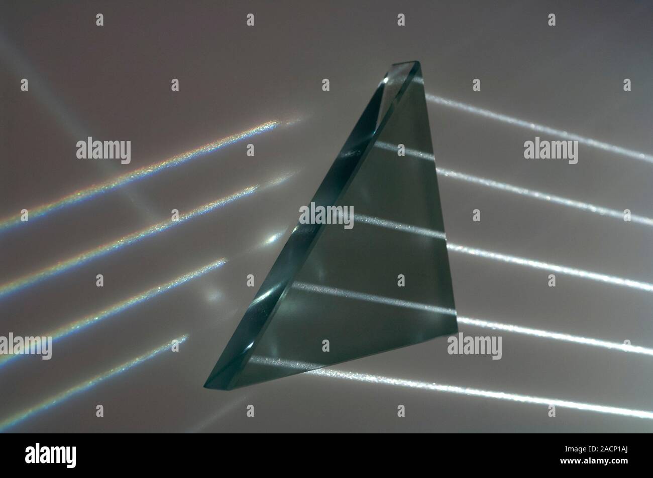Light rays and triangular prism. As light rays pass between transparent ...