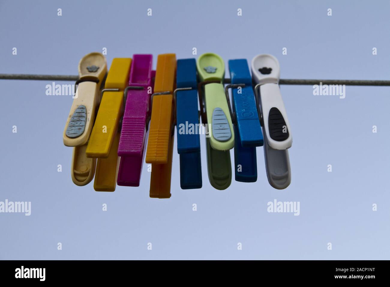 Pink plastic clothes pegs hi-res stock photography and images - Alamy