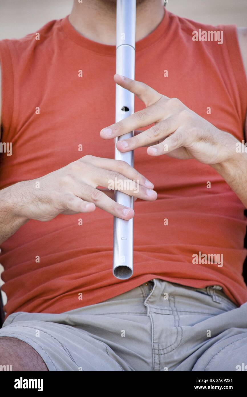 Hands playing flute hi-res stock photography and images - Alamy
