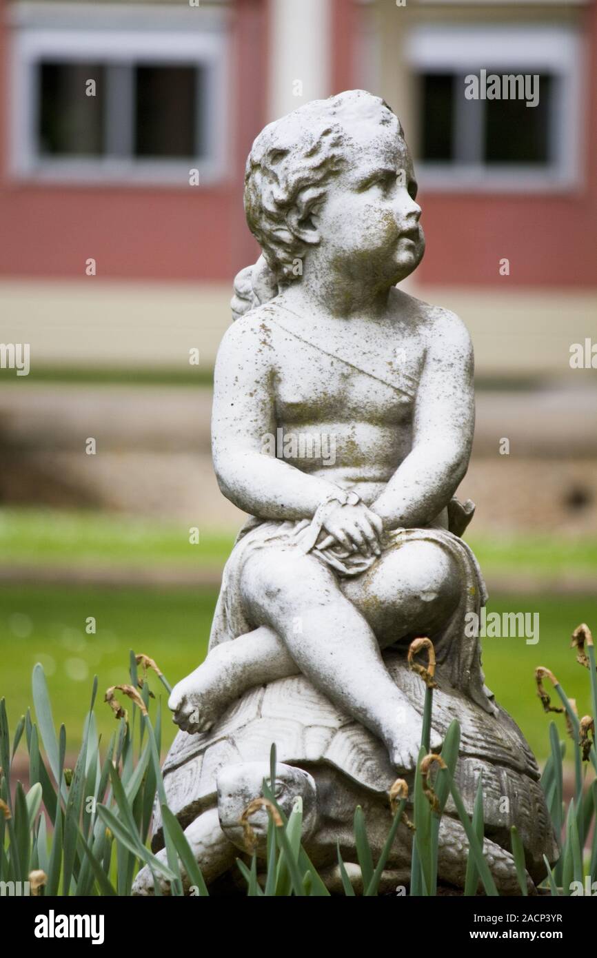 statue of a young child on a urban park Stock Photo - Alamy