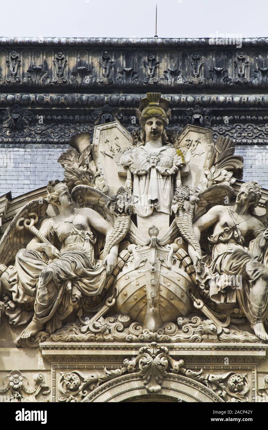 beautiful statues located on the Museum of the Louvre in Paris, France ...