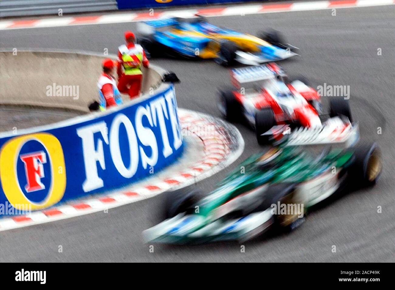 Formula 1 cars racing around a corner during the Sao Paulo Grand Prix ...