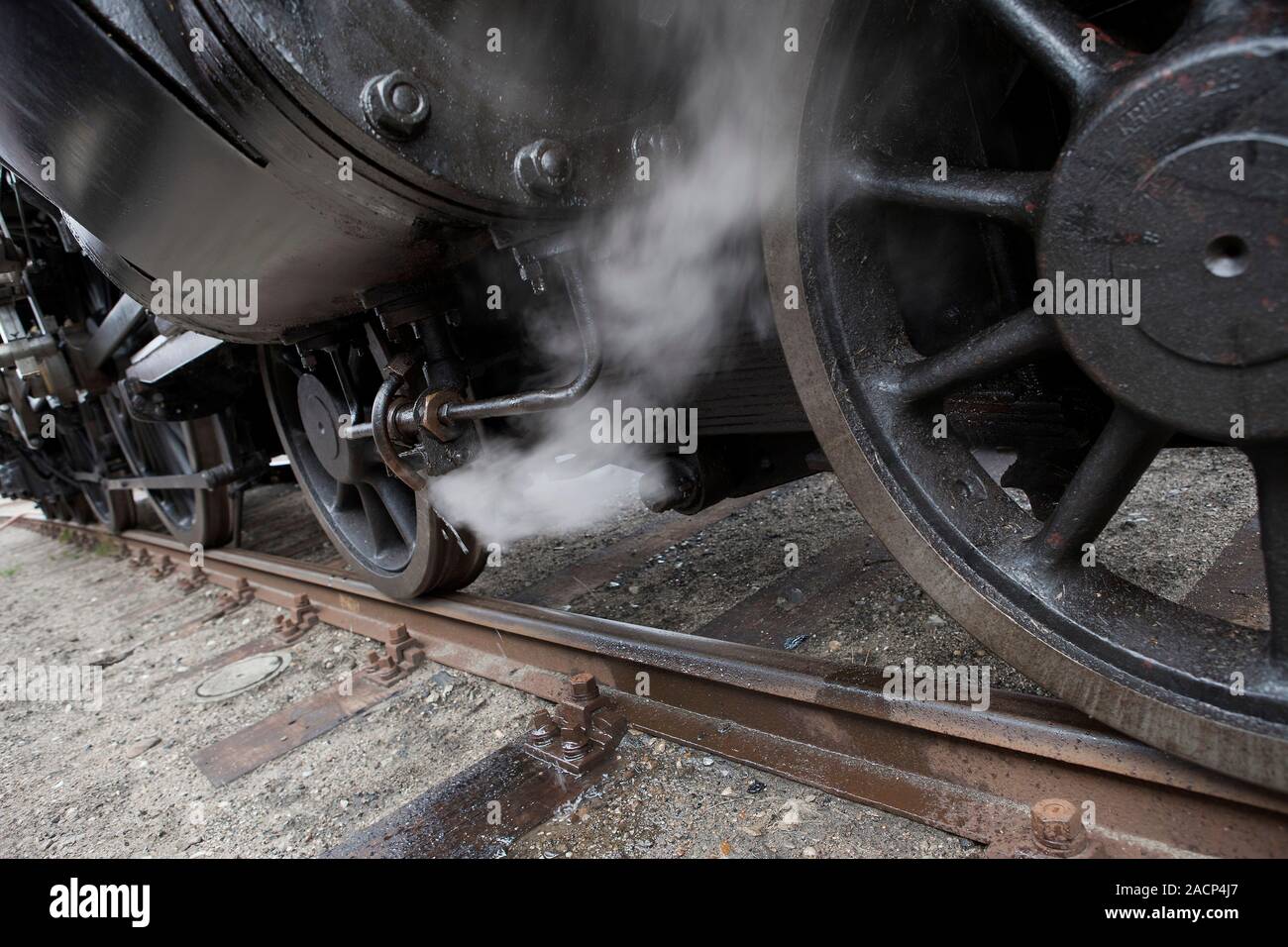 Steam locomotive valve. Close-up of steam being released from a valve ...