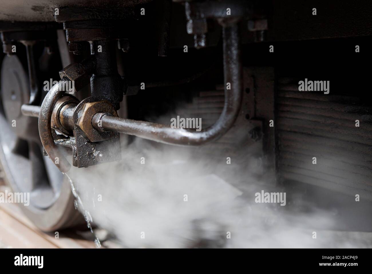 Steam locomotive valve. Close-up of steam being released from a valve ...