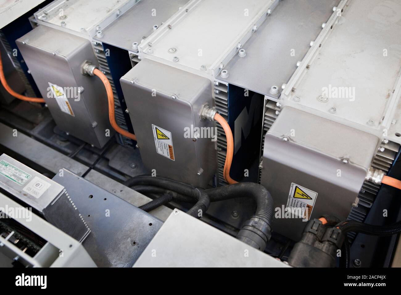 Diesel-electric hybrid bus conversion. Rooftop capacitors storing ...