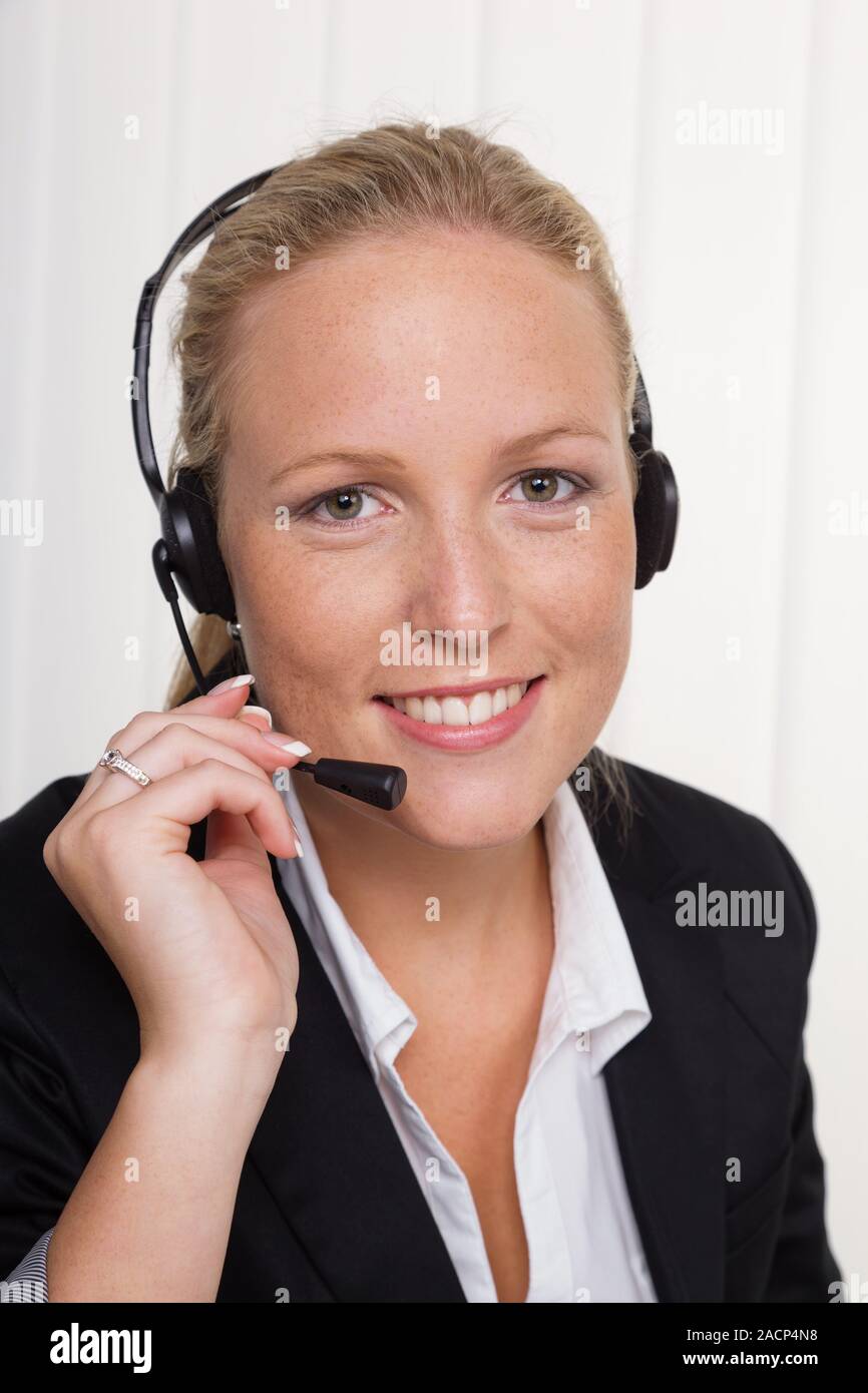 friendly woman with headset in customer service Stock Photo - Alamy