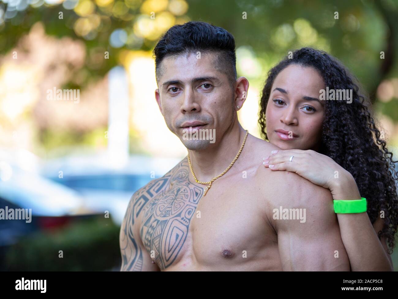 Stock photo of a Vertical photo of a young couple of different ...