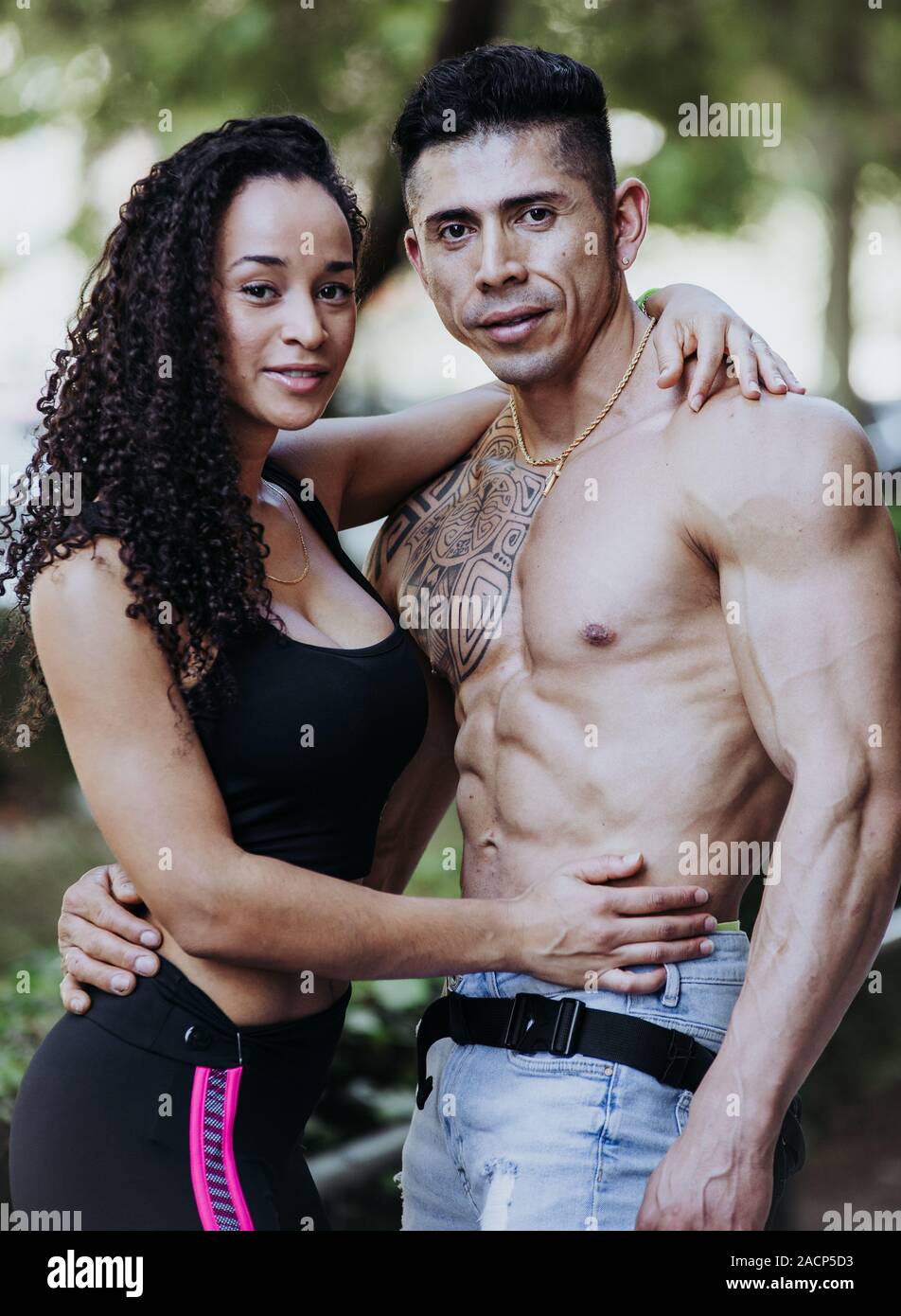 Stock photo of a Vertical photo of a young couple of different ...