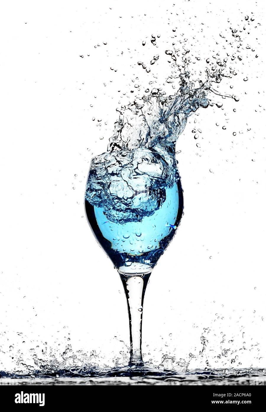 Water splashing in and around a glass, high-speed image Stock Photo - Alamy