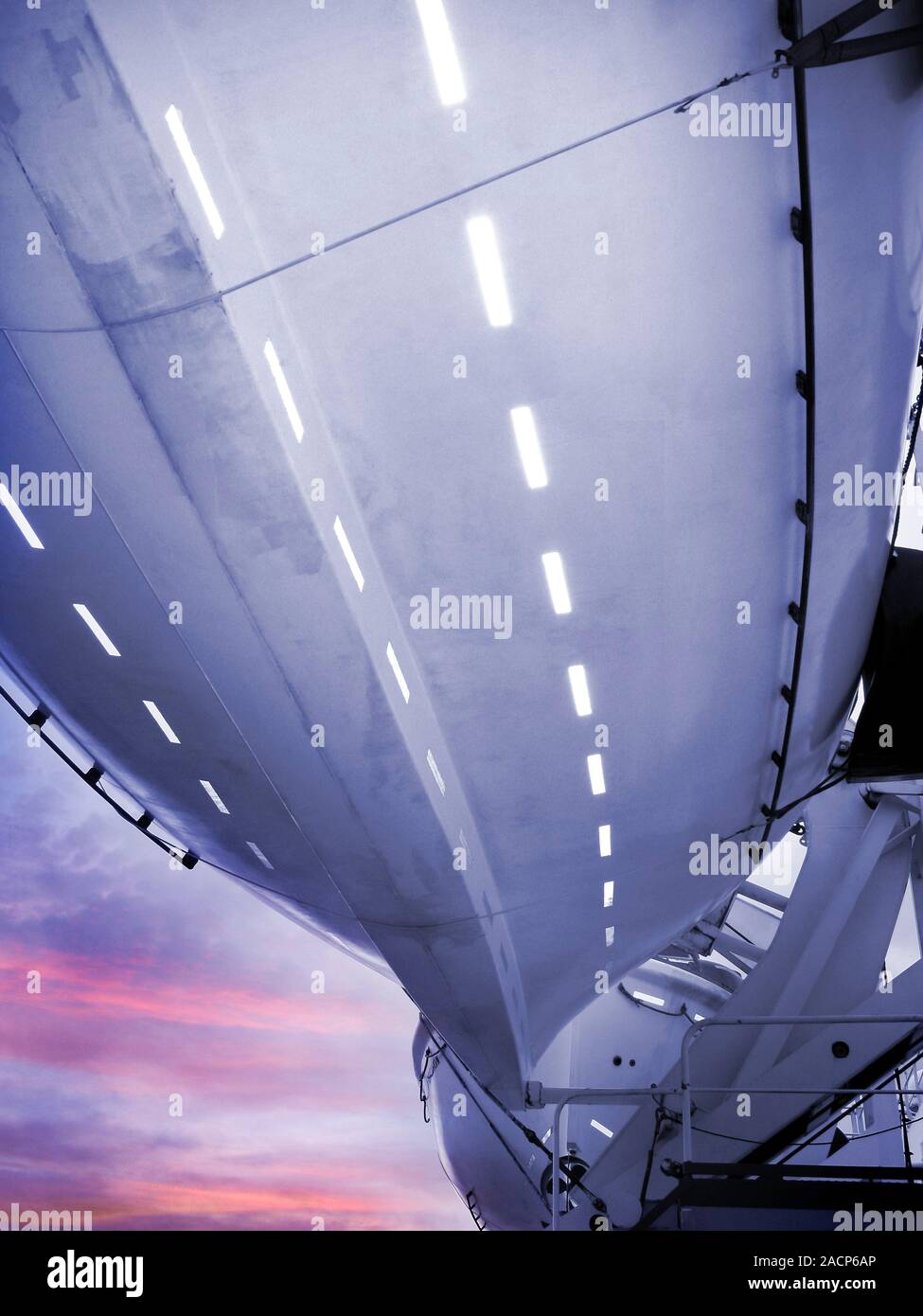 Shipboard lifeboat hull. This lifeboat has reflective tape on its hull ...
