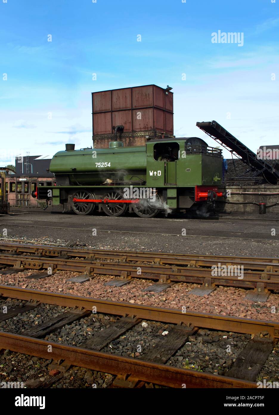 Steam locomotive in sidings. 1940s steam locomotive being supplied with ...
