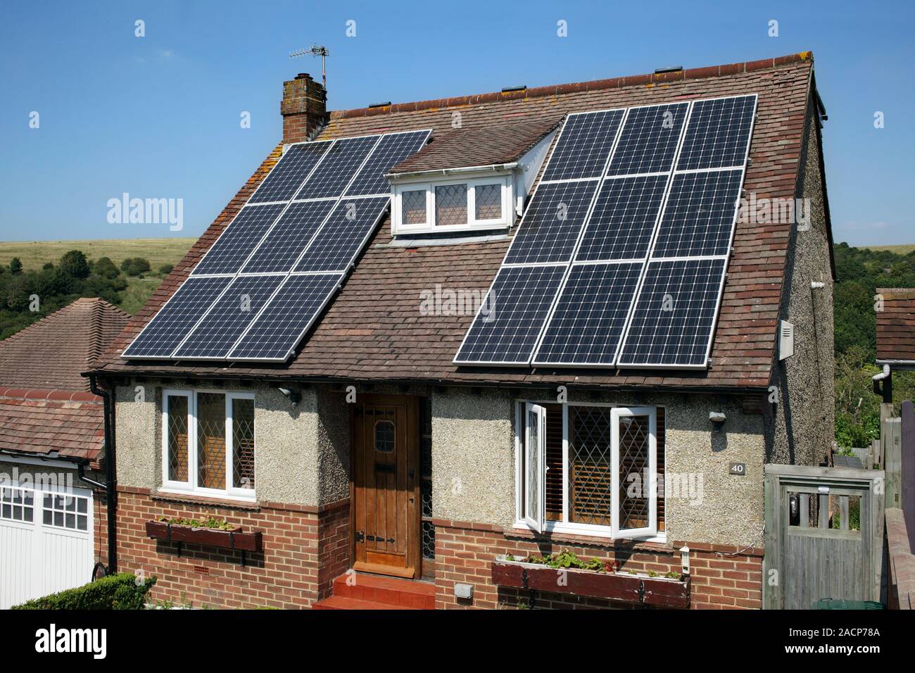 Domestic solar power. Photovoltaic cells on the roof of a house ...