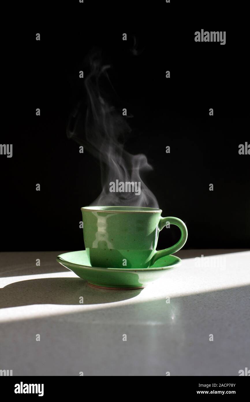 Steam rising from a cup of coffee Stock Photo - Alamy