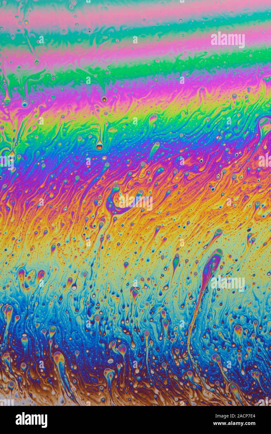 Colours in a soap film. The colours are produced by the interference of ...