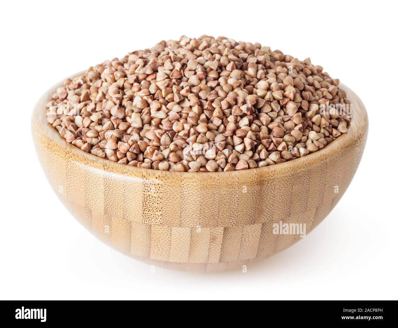 Roasted buckwheat grains in wooden bowl isolated on white background ...