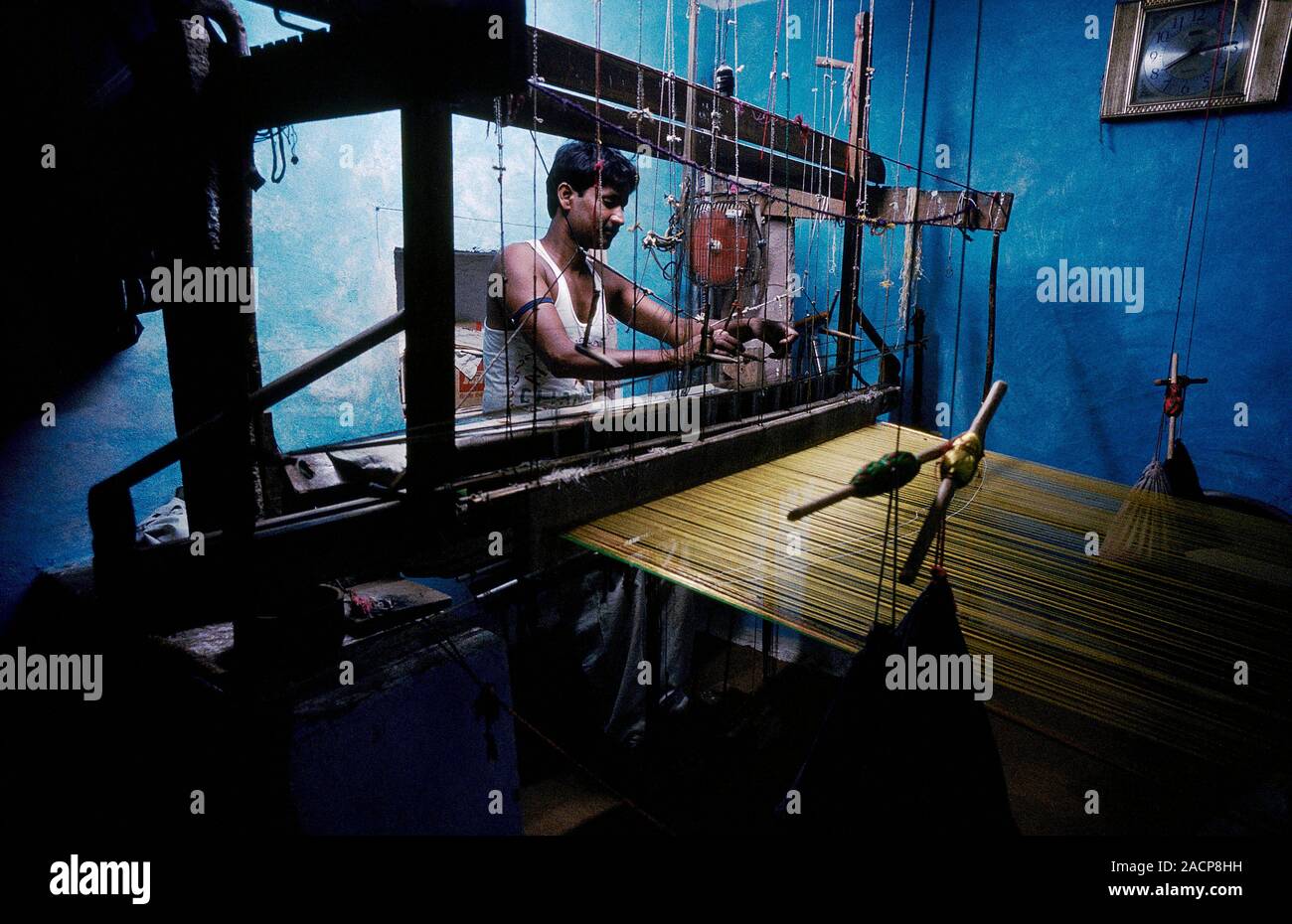 Sari weaving. Muslim weaver making a sari on a loom at night ...