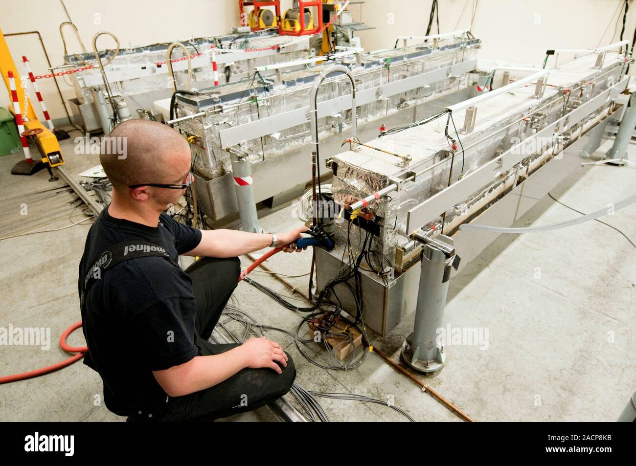 Water resistance testing. Technician testing the resistance of a ...