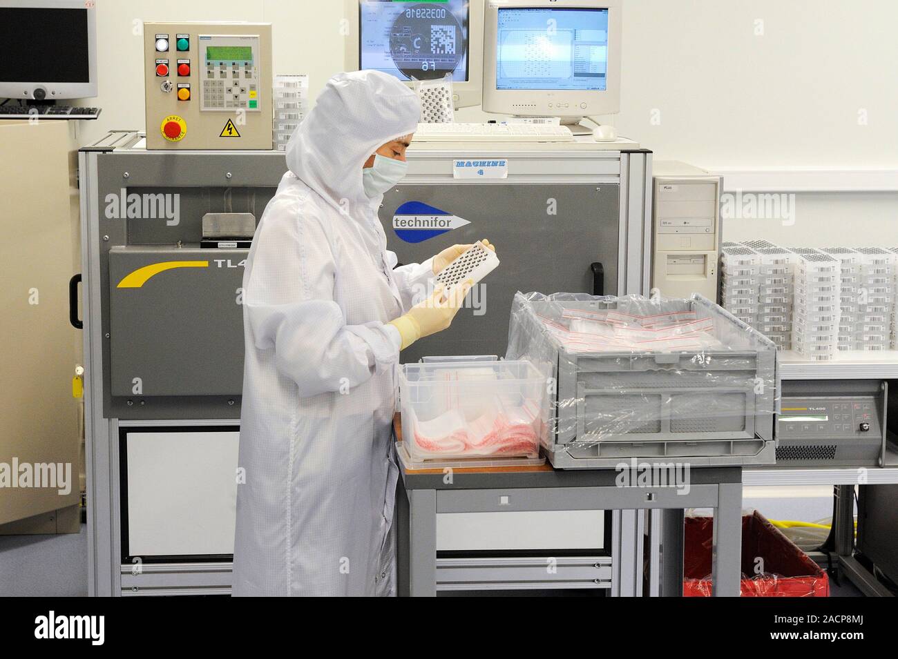 Injection moulding. Injection moulded plastic archival containers being ...