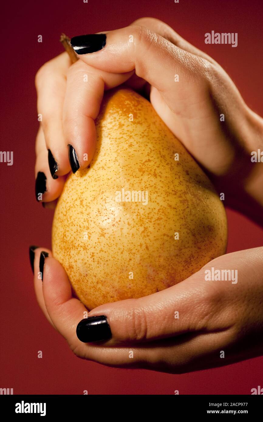 hands holding pear Stock Photo - Alamy