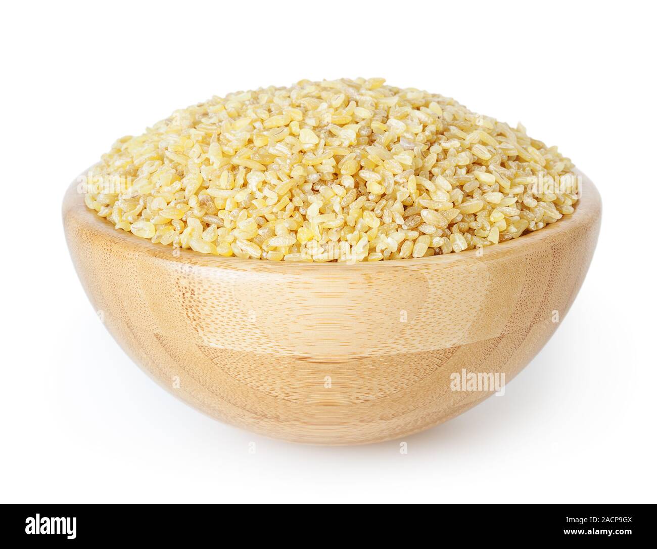 Uncooked bulgur in wooden bowl isolated on white background with ...