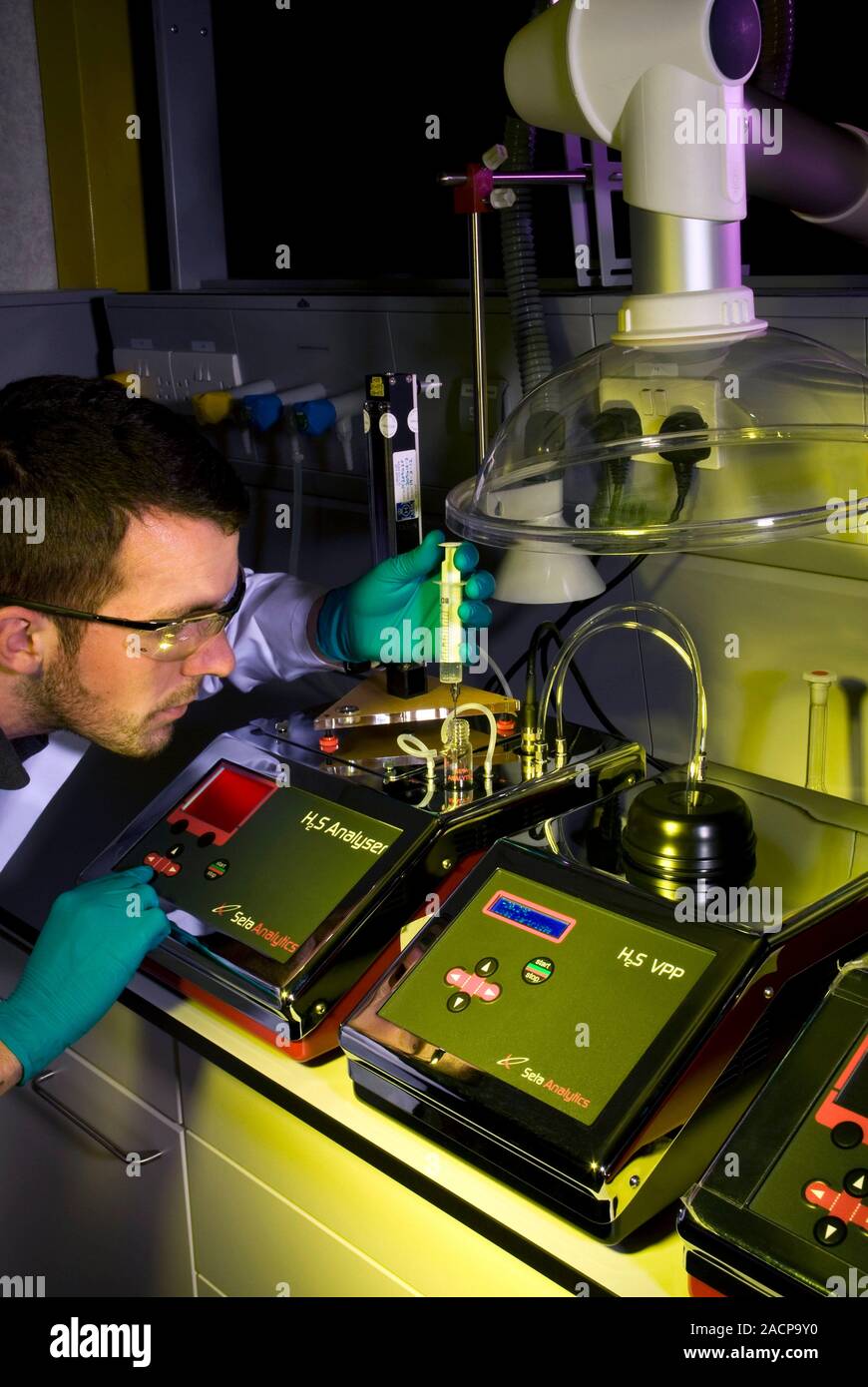 Marine fuel analysis. Industrial researcher carrying out a calibration ...