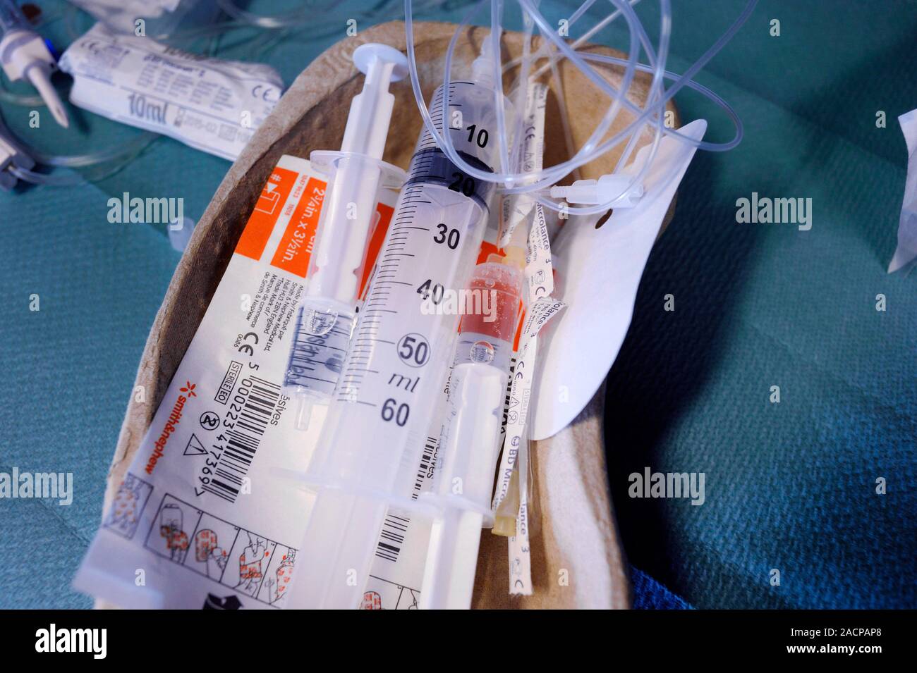Hospital syringes. Close-up of syringes and packaging, used at a ...