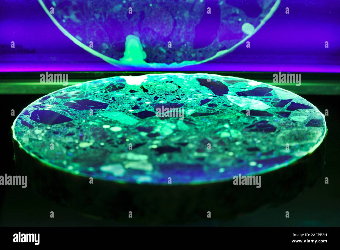 Concrete sample analysis. Sample of concrete being analysed under a ...
