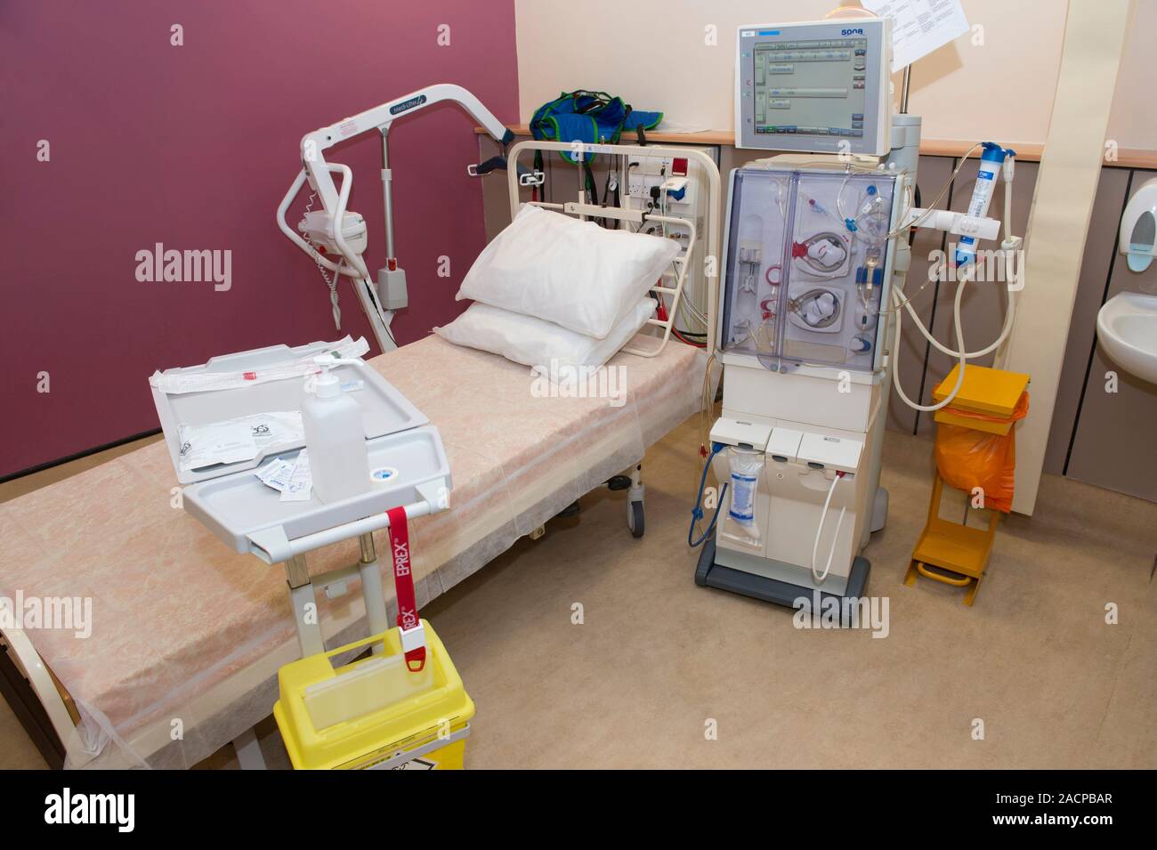Haemodialysis suite in a hospital showing a bed surrounded by medical ...