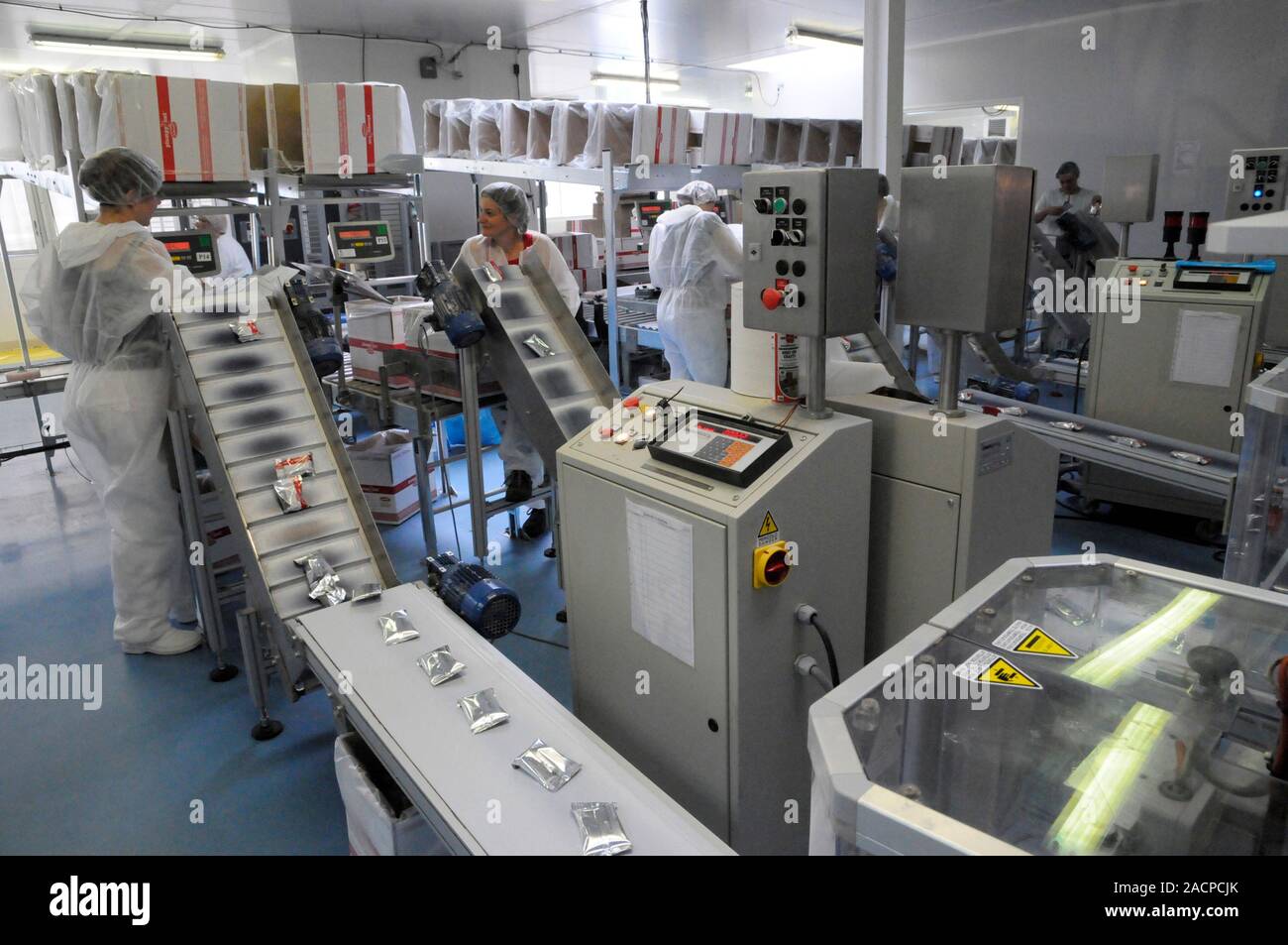 Therapeutic food factory. Workers on a production line producing Plumpy ...