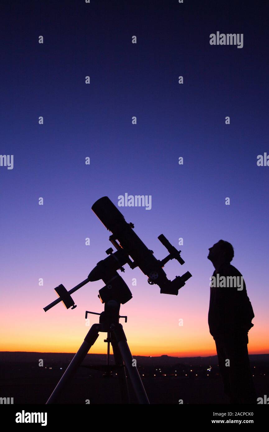 Astronomer using a telescope Stock Photo - Alamy