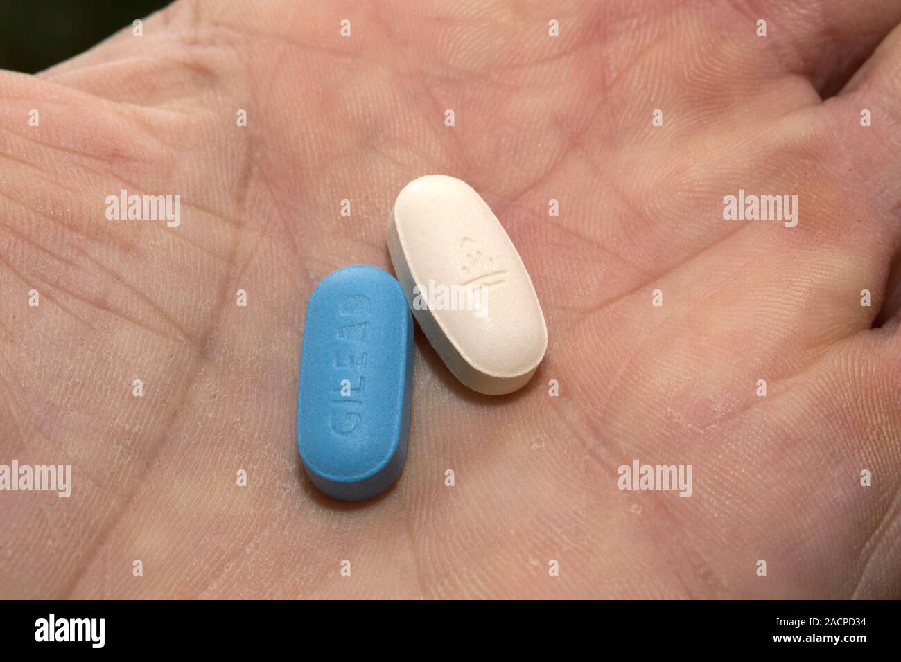 HIV drugs. Tablets of the antiretroviral drugs nevirapine (white) and ...