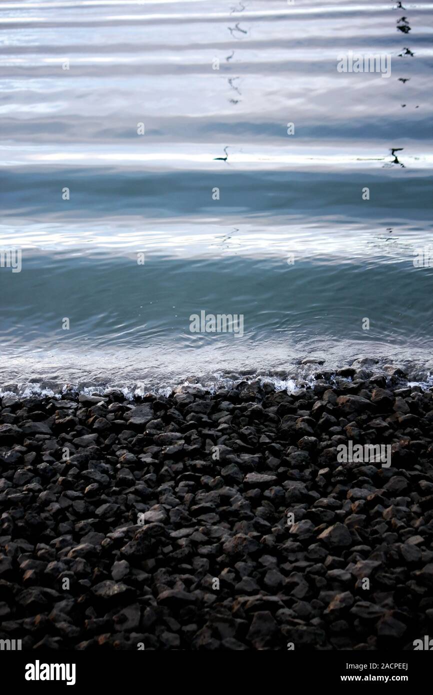Small wave at shoreline Stock Photo - Alamy