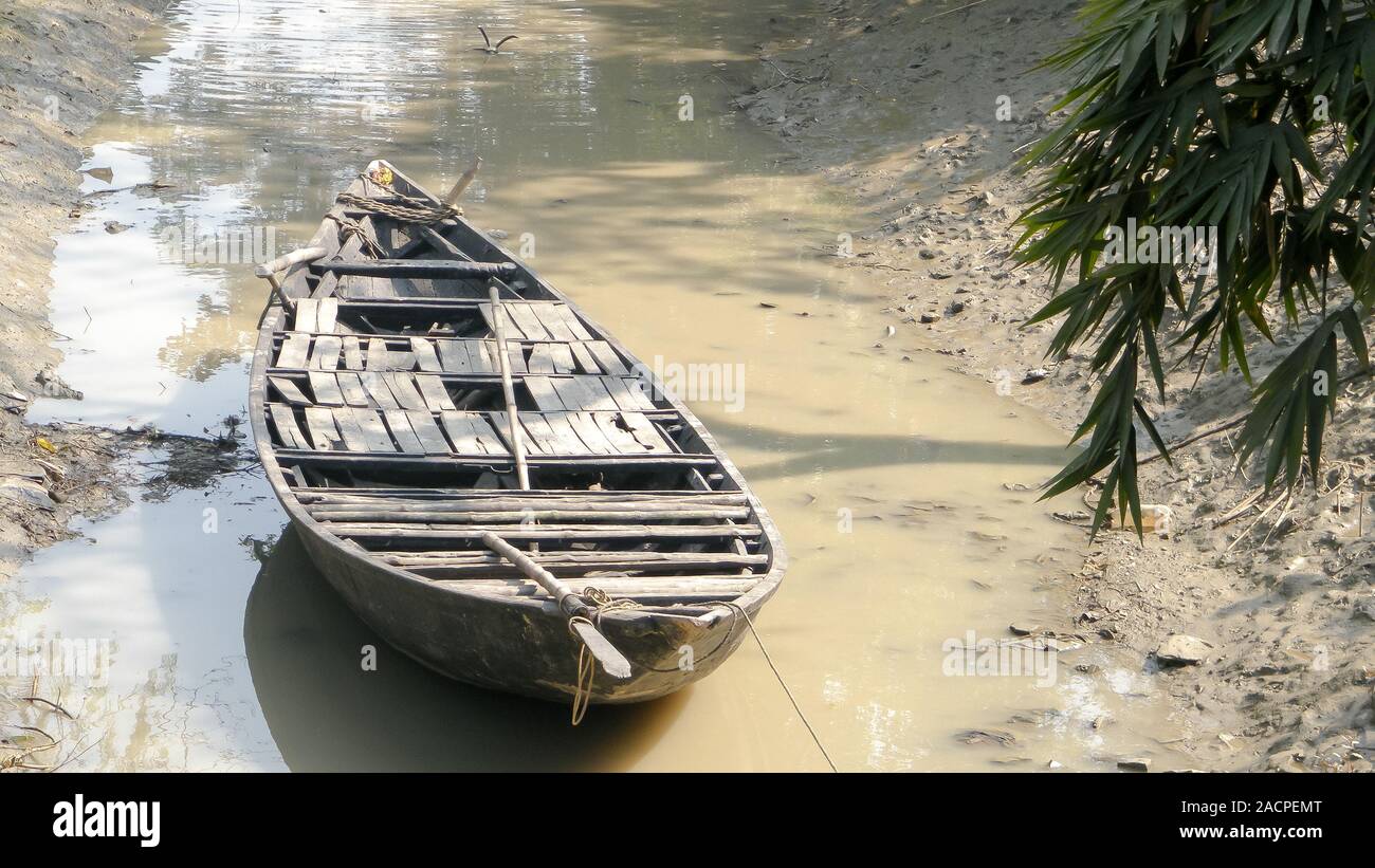 The Old Wooden Canal Boat floating over saltwater water canal of Ganges ...